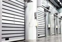 China Wind Resistant Weather Sealed Double Skinned Steel Overhead Sectional Door With Lock for sale