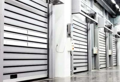 China Wind Resistant Weather Sealed Double Skinned Steel Overhead Sectional Door With Lock for sale