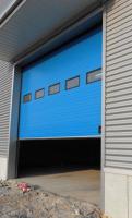 China Wind Resistant White Powder Coated Insulated Steel Overhead Sectional Door for sale