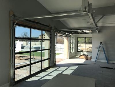 China Manual Or Automatic Water Tightness Class 3 Transparent Glass Sectional Garage Door With Excellent Insulation for sale