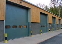 China Commercial Sectional Overhead Doors With Weather Sealed Protection And Lockable Handle for sale