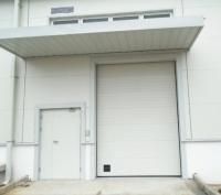 China Sectional Overhead Door 50mm-80mm Thickness Insulated Sectional Garage Door For Mall And Commercial for sale