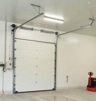 China Commercial Sectional Overhead Door 50mm-80mm Thickness Insulated Garage Door With Brown Locks Hardware for sale