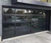 China Manual Or Automatic Opening Water Tightness Class 3 Transparent Garage Door Aluminum Alloy Glass Material for sale