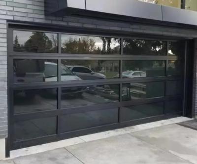 China Manual Or Automatic Opening Water Tightness Class 3 Transparent Garage Door Aluminum Alloy Glass Material for sale