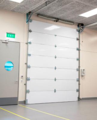 China Powder Coated Sectional Overhead Door 50mm-80mm Thickness Insulated Sectional Garage Door Commercial for sale