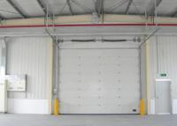 China Fire Station Industrial Commercial Sectional Overhead Doors Noise Reducing White Colour Automatic Formed for sale