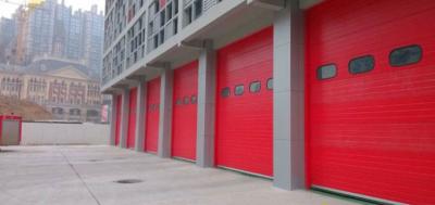 China Fire Station Automatic Formed Industrial Sectional Doors With Lockable Handle And White Sectional Steel Doors for sale