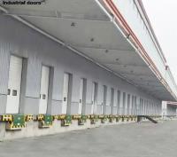 China 50mm-80mm Thickness Modern Steel Automatic Sliding Windproof Remote Control Commercial Insulated Sectional Garage Door in Powder Coated Finish for sale