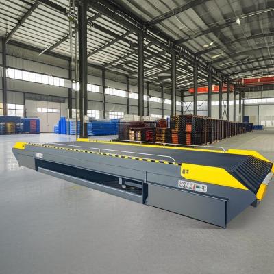 China 25000-40000LBS Safe Design Dock Door Levelers Workshop Automatic Dock Plate with On-site Installation and Safety Curbs for sale