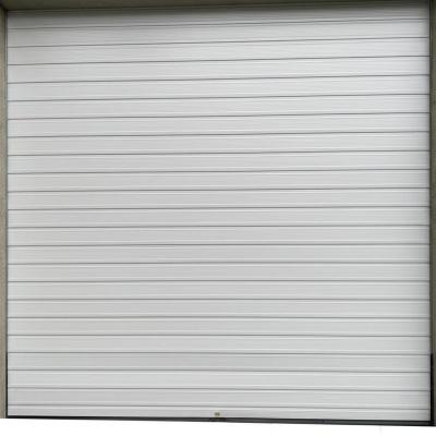 China Customized White Overhead Door 50mm-80mm Thickness Insulated Commercial Industrial Sectional Garage Door Remote Control Efficient Warehouse Operations for sale