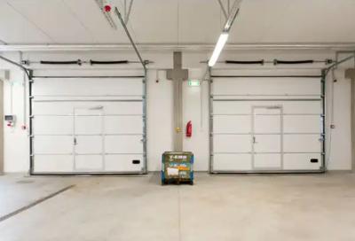 China Finger Safe Lightweight Foam Sandwich Panel Insulated  Commercial Overhead Sectional Garage Doors Powder Coated Finish for sale