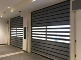 China Aluminum Alloy Industrial Automation Roll Up Door High Speed Spiral Door Safety Efficiency Wind Resistance 2.0knm2 Safety Efficiency for sale