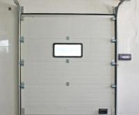 China Waterproofing Automatic Industrial Sectional Door 50mm Panel Coated Steel Sandwich for sale