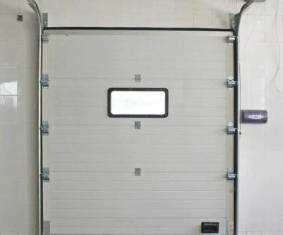 China Waterproofing Automatic Industrial Sectional Door 50mm Panel Coated Steel Sandwich for sale