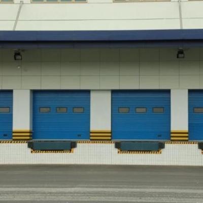 China Wind Load Industrial Overhead Sectional Doors Surface Embossing Anti Breaking for sale