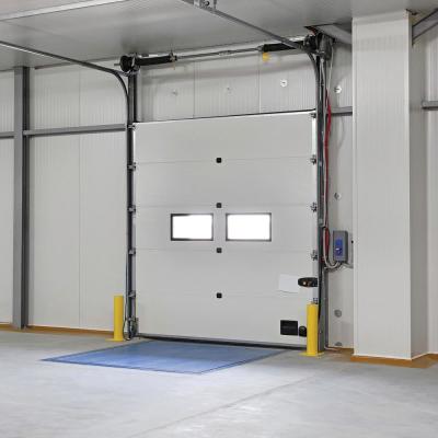 China Rapid Response Industrial Overhead Sectional Door 700N/M2 Anti Wind Pressure for sale