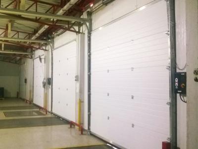 China Rapid Response 700N/M2 Windproof Overhead Sectional Door for sale
