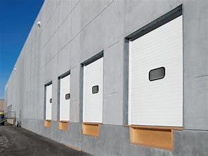 China Sus304  Powder Coating Thermal Insulated Sectional Doors Pinch Resistant For Warehouse for sale