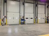 China 12 Feet Exterior Roll Up Insulated Workshop Dock Doors Industrial Vertical PU Panel for sale