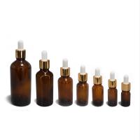 China 100ml Amber Essential Oil Glass Bottles DIN18 Size With Golden Cap for sale