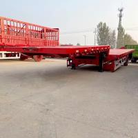 China 100t 3 Axles Low Bed Lowboy Flatbed Semi Trailer Truck with Hydraulic Lift and Gooseneck for sale