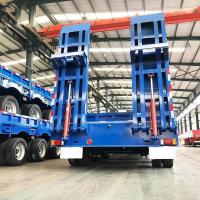 China Low Bed Truck Trailer Lowboy Flatbed Truck Iron Tread 1820mm Heavy Duty 3 Axles 100t for sale