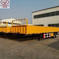 China 50tons Heavy Duty 3 Axle 13m Cargo Transport Flatbed Trailer with Side Wall and Fence for sale