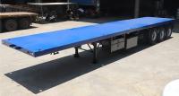 China 8.12.16 Tire 3/4 Axle 60 Ton Container Transport Flat Deck Truck Trailer Semi-Trailer for sale