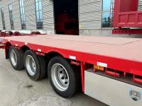 China 1820mm Tread 40FT 50 Ton Shipping Container Semi-Trailer 3 Axle Steel Flat Bed Truck for sale