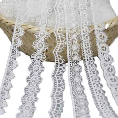 China Wholesale Embroidered Milk Yarn Polyester French Lace Trim Water Soluble Knitted Fabric Flower Decoration for Ladies' Garments for sale