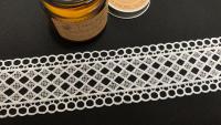 China 5.5cm Width Milk Yarn Lace Trim with Geometric Hollow Pattern and Neat Edge Stable Workmanship for Garment Decoration for sale