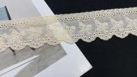 China Cotton Chicken Lace Trim with Delicate Bow Embroidery Wavy Scalloped Borders and Neat Hollow Eyelet Details for Garment Trimming for sale
