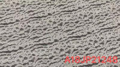 China Stretchy Lace Fabric with Irregular Leaf-shaped Motifs and Fine Mesh Base for Soft Elastic Feel in Dress and Ladies Apparel for sale