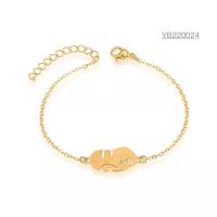 China Luxury Stainless steel hand chain 14k gold abstract girl face painting bracelets for sale