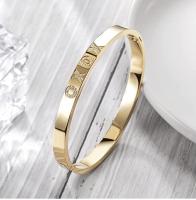 China 5mm Width XOXO Alphabet Gold Rhinestone Bracelet Stainless Steel Snap Bangle for sale