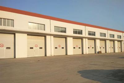 China High Speed Industrial Sectional Doors Safe 40mm Insulated Sandwich Panel for sale