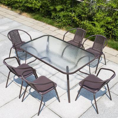 China Outdoor Patio Rattan Dining Table and Chair Set 6 Seater Metal Frame Glass Top for sale
