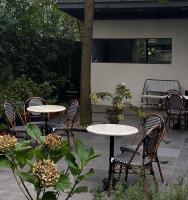 China Outdoor Garden Rattan Dining Table and Chair Set 4 Seater Metal Frame Patio Furniture for sale