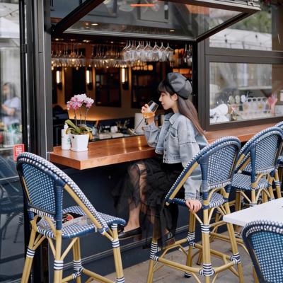 China Outdoor French Bistro Chairs PE Rattan Patio Furniture Bamboo Look Frame 2 Seats Stackable for sale