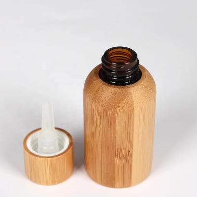 China 15ml 30ml 50ml Empty  Bamboo Cosmetic Essential Oil Glass Bottle Screaw Cap for sale