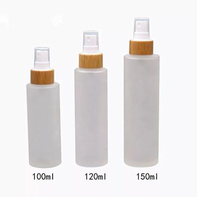 China 100ml Frosted Glass Bottle with Bamboo Pump Cosmetic Toner Container Skin care for sale