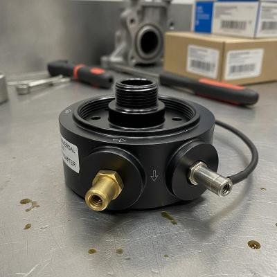 China Universal oil filter sandwich plate adapter, installs between the engine block and oil filter. Features 2dedicated 1/8