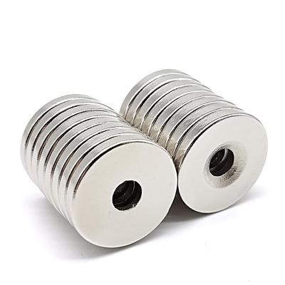 China Tolerance about /0.05mm N35 N50 N52 Ndfeb Magnet Rare Earth Disc Magnet with Hole for sale