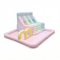 China Pastel Rainbow Triple Lane Inflatable Slide with Ball Pit Bounce House 5x5m PVC for Kids Parties for sale