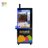 China Drop In Win Claw Crane Machine With Rotating Prize Hole Commercial Ball Catching Machine for sale