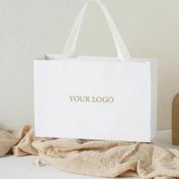China Foldable Retail Shopping Bags Custom Printed Paper Carrier Bags For Skincare Product for sale