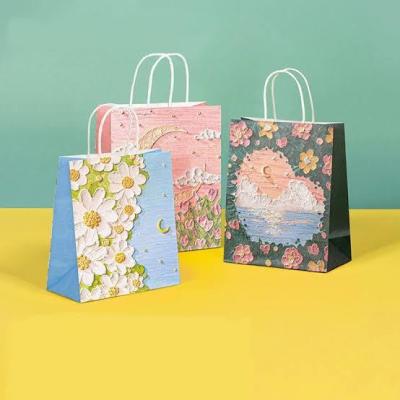 China Bulk Cardboard Gift Paper Goodie Bags 350gsm Recyclable Kraft Paper Packaging With Handles for sale