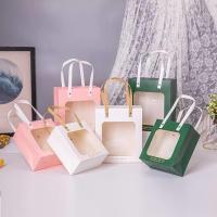 China Bulk Cardboard Gift Paper Goodie Bags 350gsm Recyclable Kraft Paper Packaging With Handles for sale