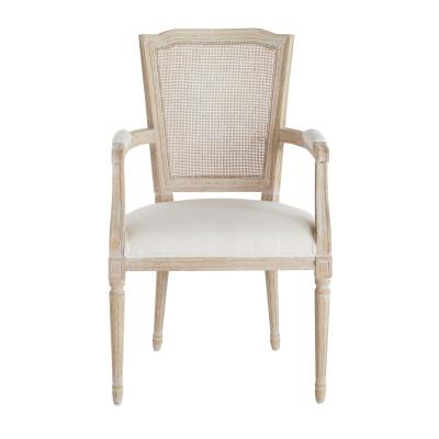 China French-Style Dining Chair with Carved Wood, Natural Rattan Back, Linen Upholstered Seat, and Armrests for sale